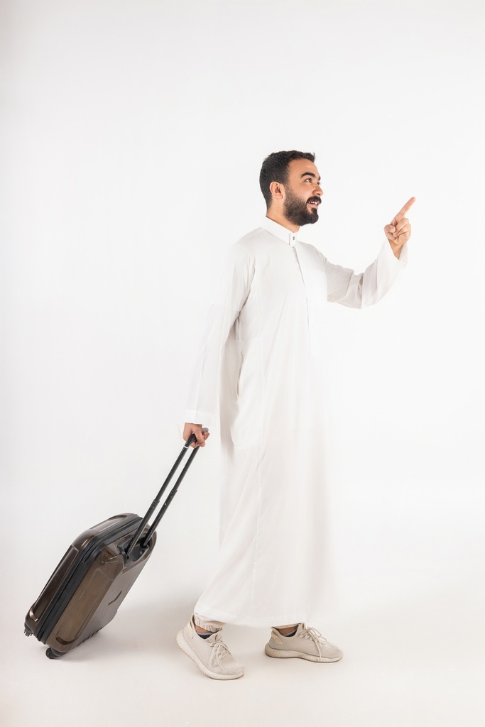 a khaliji man travelling with his bag stock image | Jini Stock