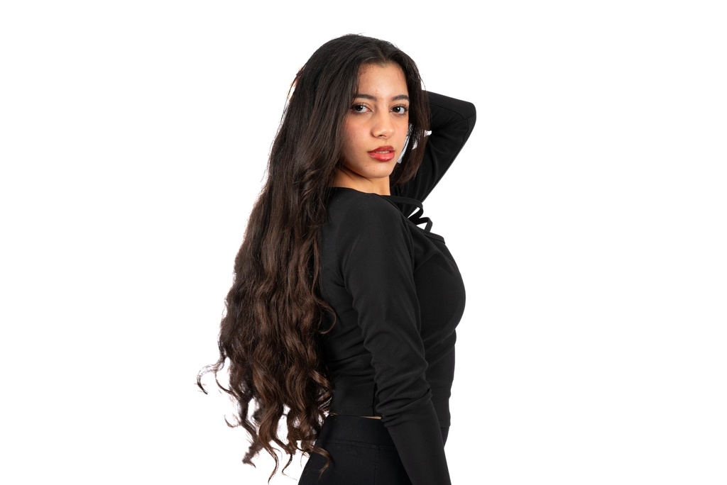 Egyptian girl with long black hair side view | Jini Stock
