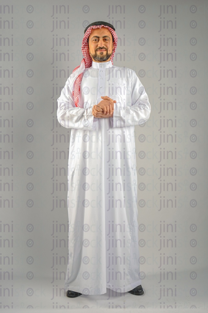 A man from the Gulf Saudi Arabian or Emirati smiling. | Jini Stock