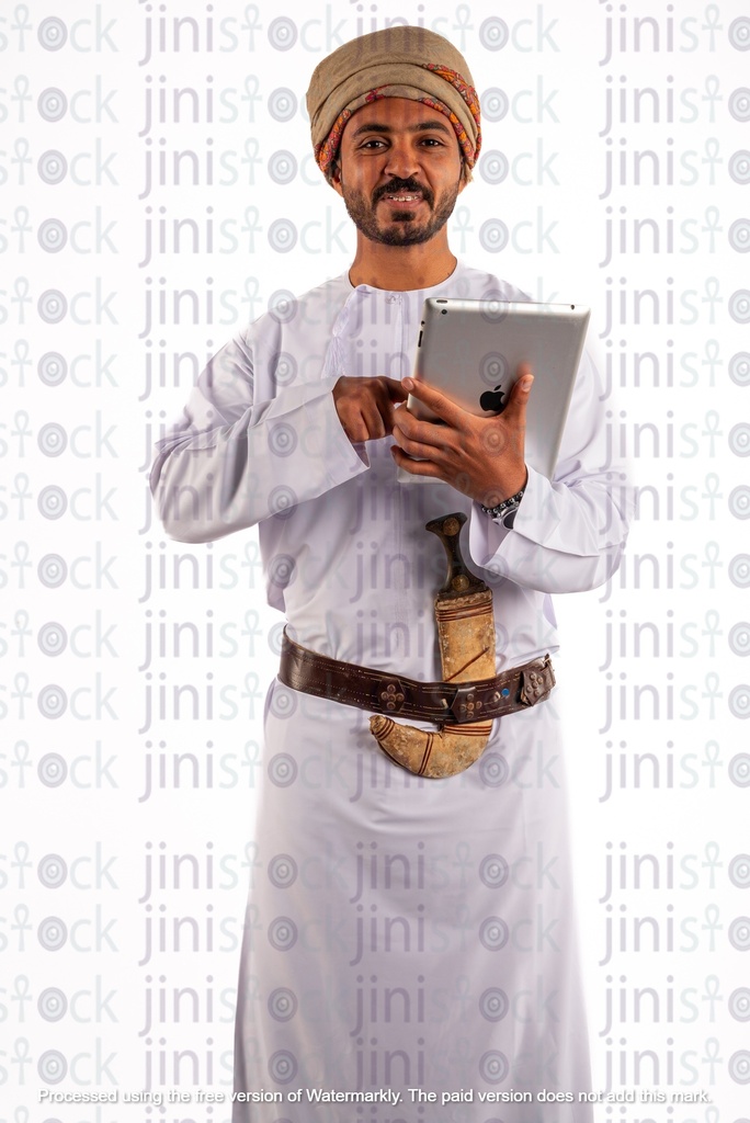 Omani arab khaliji man from gulf holding ipad | Jini Stock