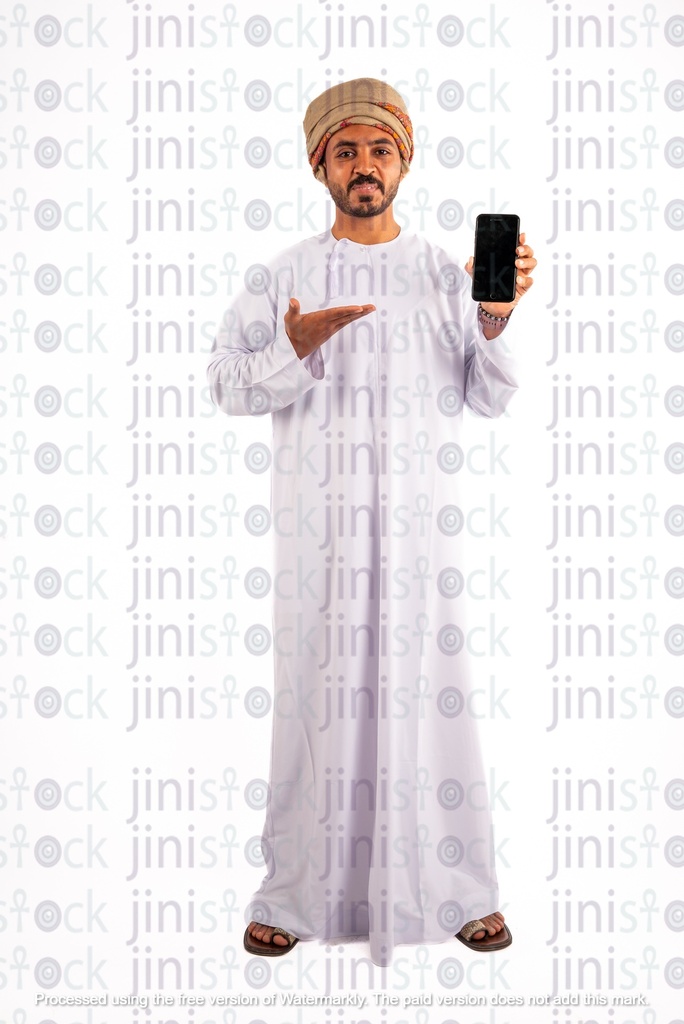 Omani arab khaliji man from gulf pointing at his mobile | Jini Stock