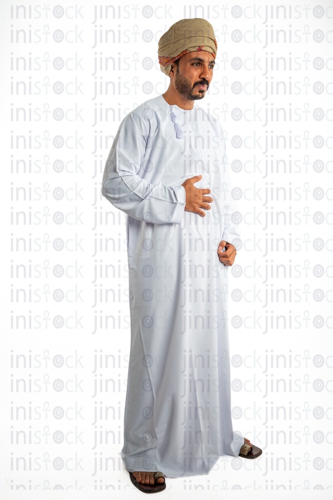 Omani arab khaliji man from gulf with stomach pain | Jini Stock