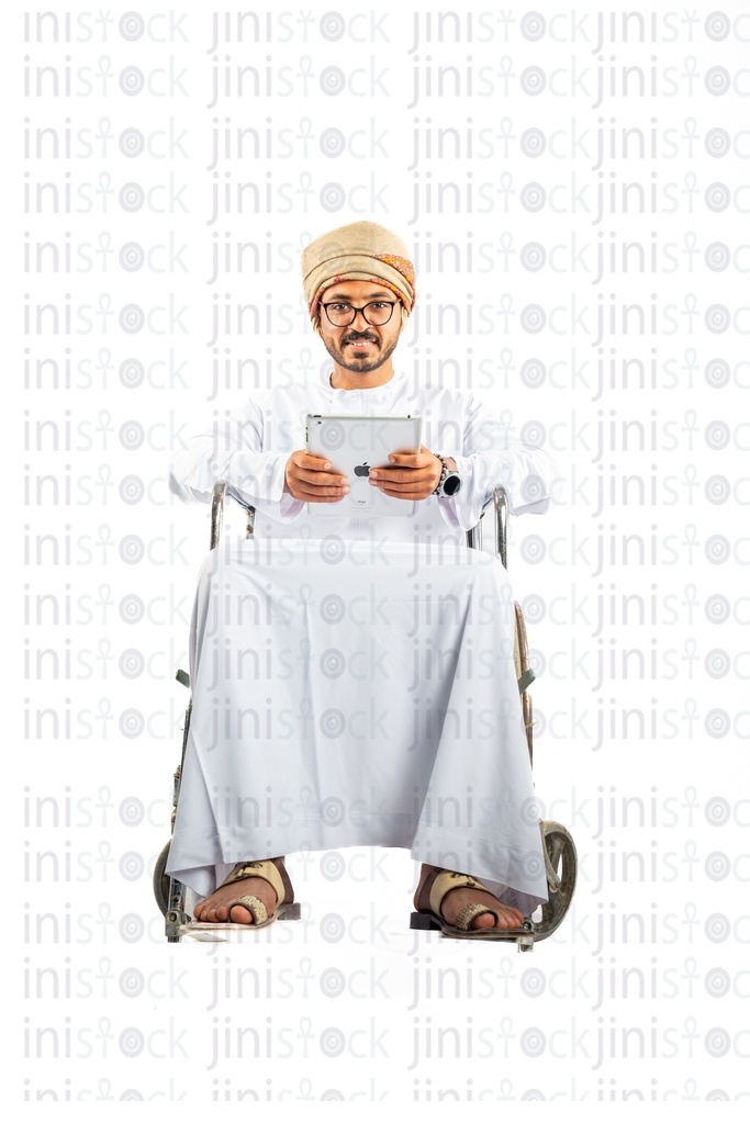 omani arab khaliji man from gulf on a wheelchair | Jini Stock