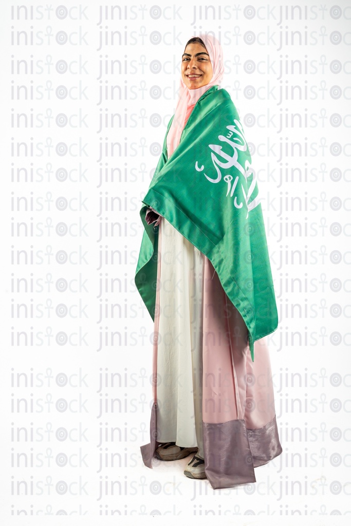 Khaliji arab woman from gulf saudi wearing ksa flag | Jini Stock