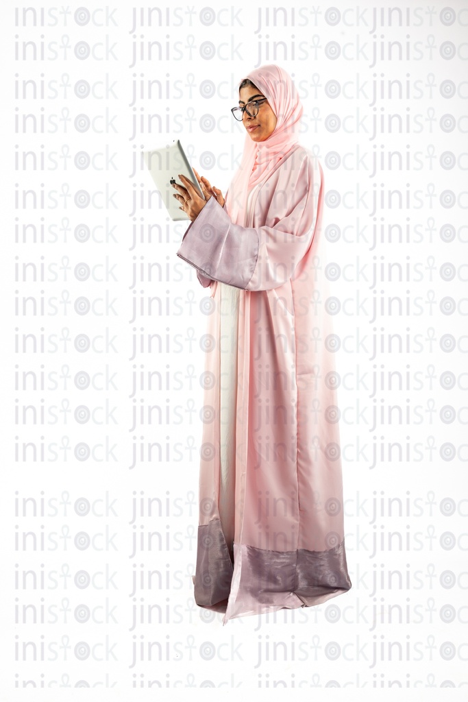 saudi khaliji woman from gulf holding ipad | Jini Stock